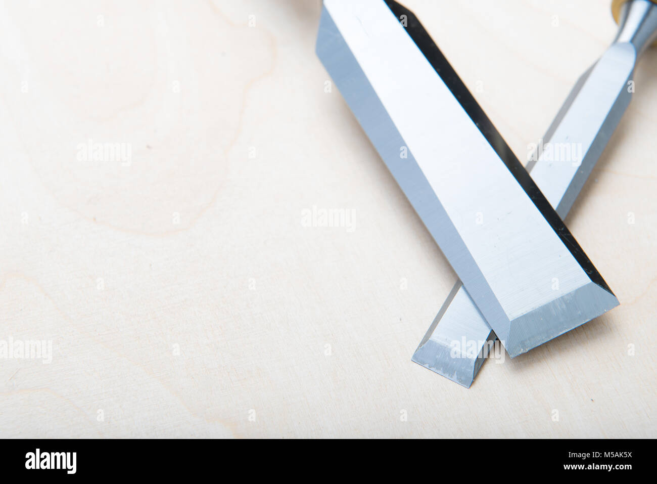 A professional chisel on a wooden background, with room for text Stock ...
