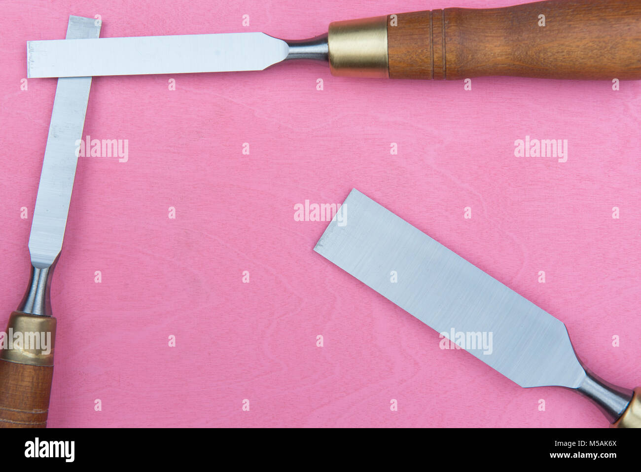 A professional chisel on a wooden background, with room for text Stock ...