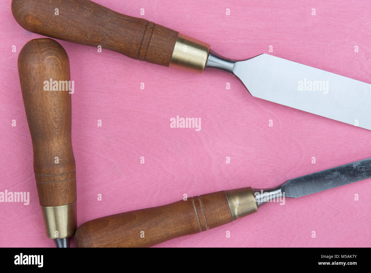 A professional chisel on a wooden background, with room for text Stock ...