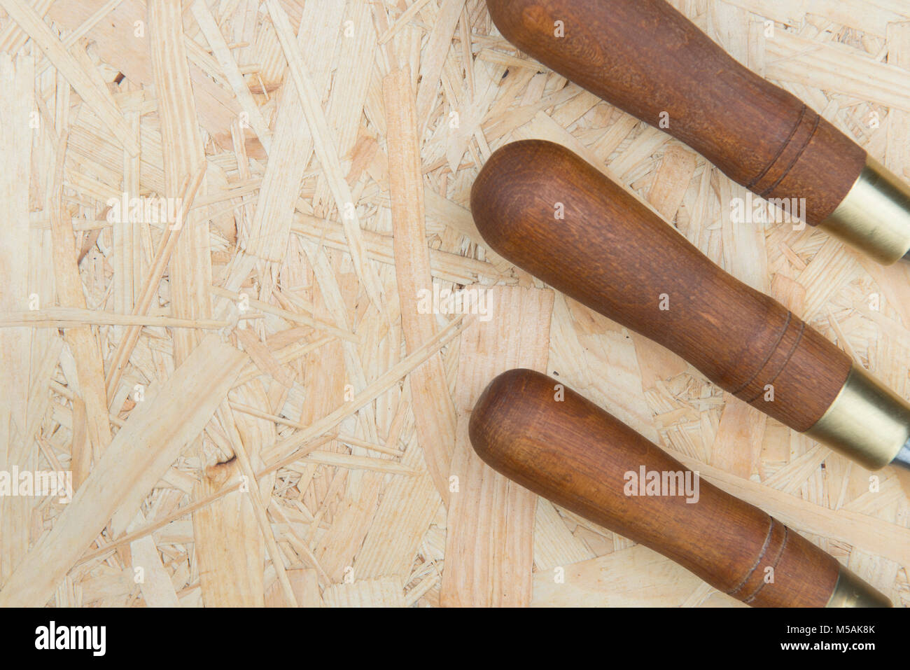 A professional chisel on a wooden background, with room for text Stock ...