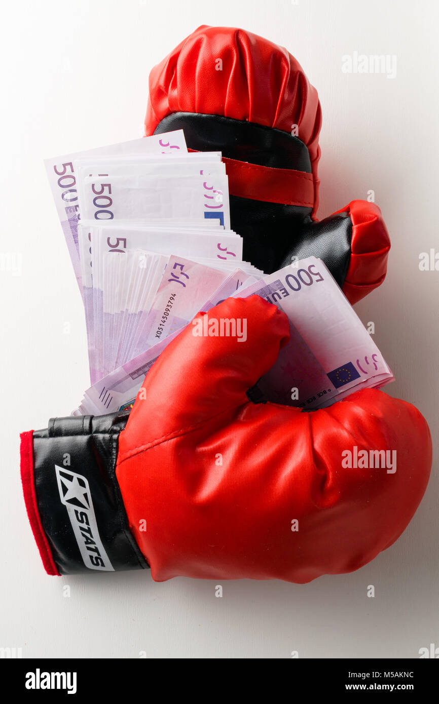 boxing for money, boxing glove with cash Stock Photo - Alamy