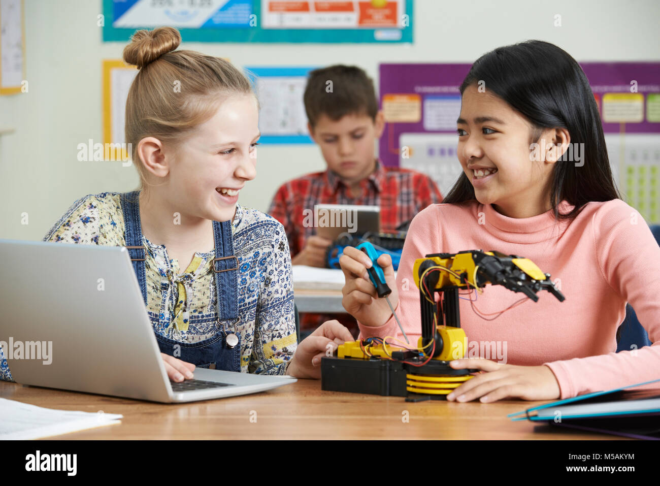 Two Female Pupils In Science Lesson Studying Robotics Stock Photo - Alamy
