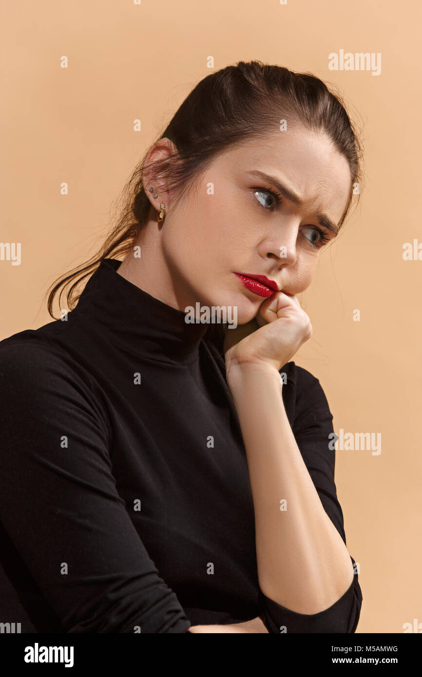 Young serious thoughtful business woman. Doubt concept Stock Photo - Alamy