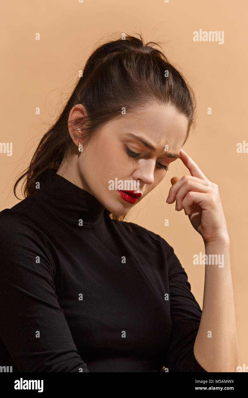 Young serious thoughtful business woman. Doubt concept Stock Photo - Alamy