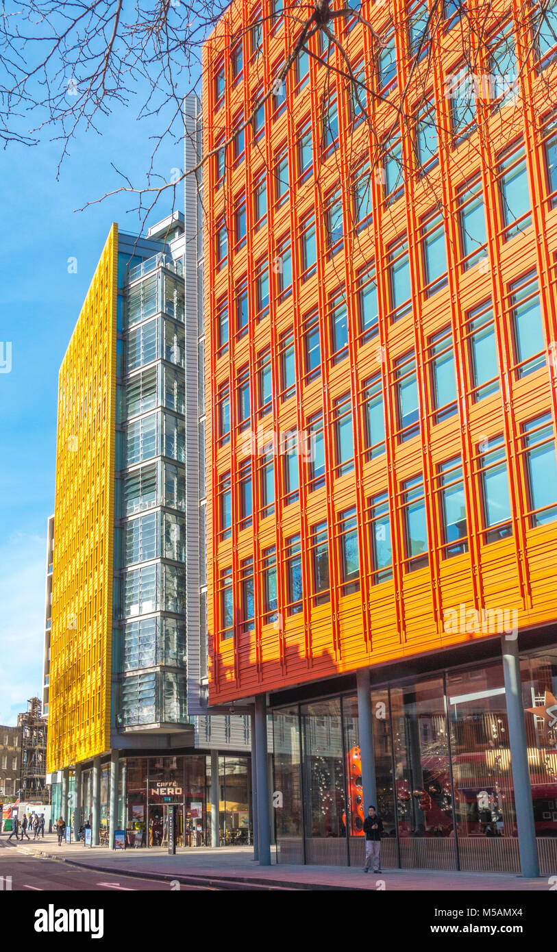 Vivid orange and yellow high rise, mixed use development (office ...