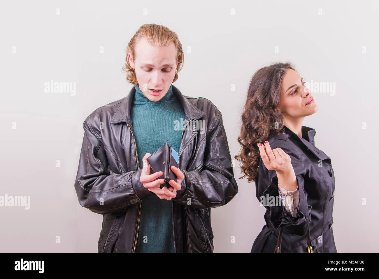 Digger wife empties husband's wallet Stock Photo - Alamy