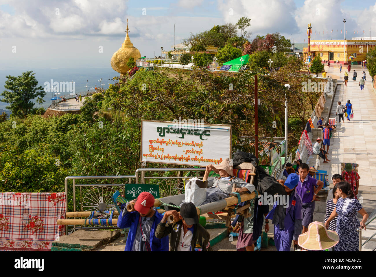 Kyaikto: mount Kyaiktiyo Pagoda (Golden Rock), porter, person in sedan ...
