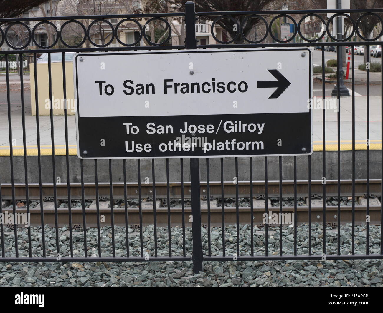 A sign indicates the direction of San Francisco in a station of the ...