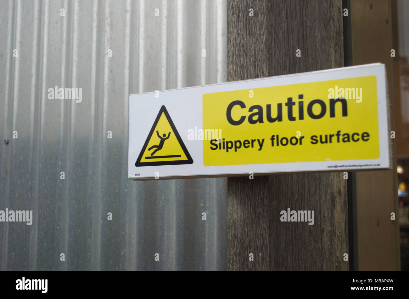 Slippery surface warning sign Stock Photo - Alamy