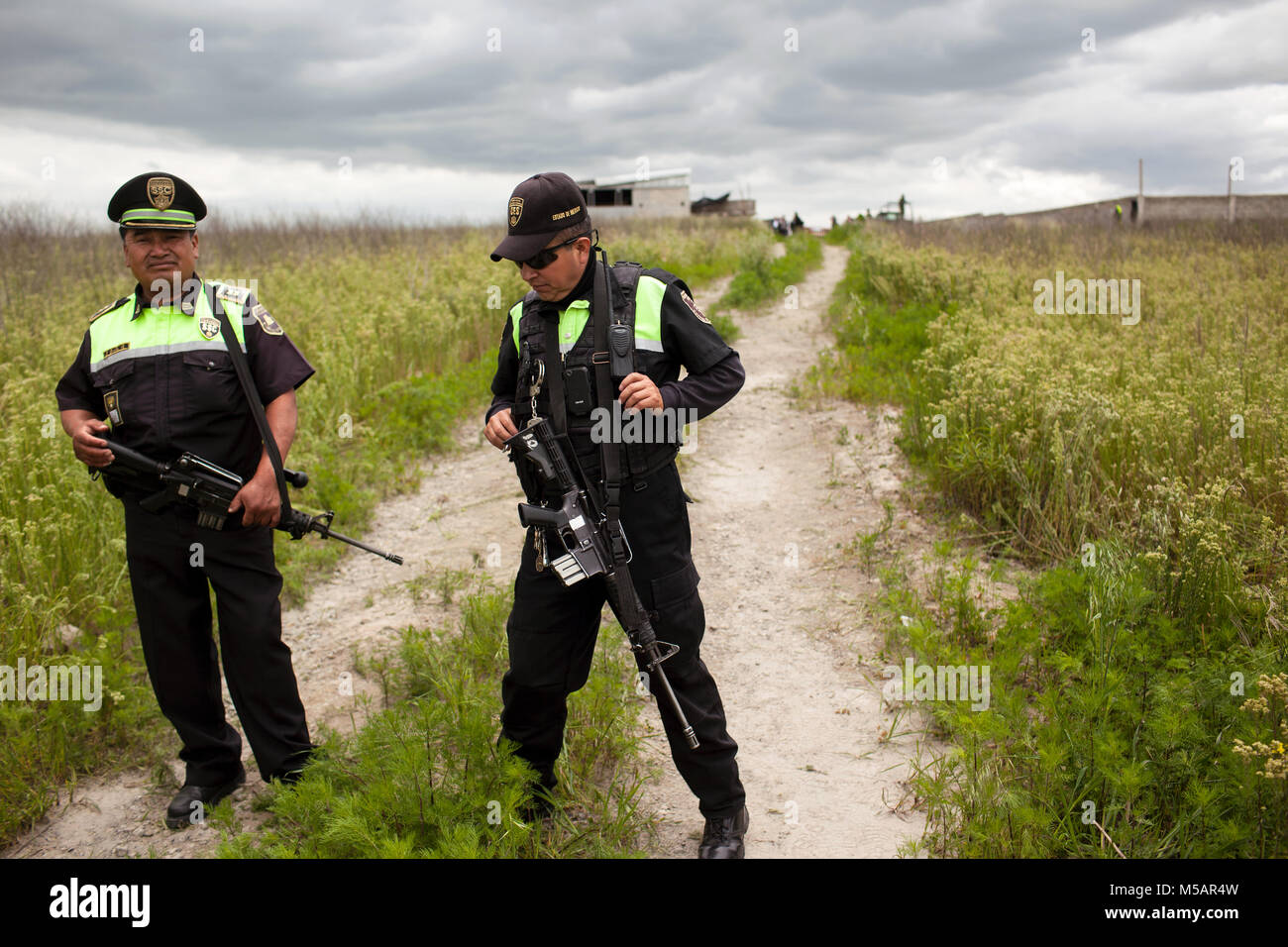 Police guard a small farm house that was used by Joaquin "El Chapo" Guzman to escape Altiplano ...