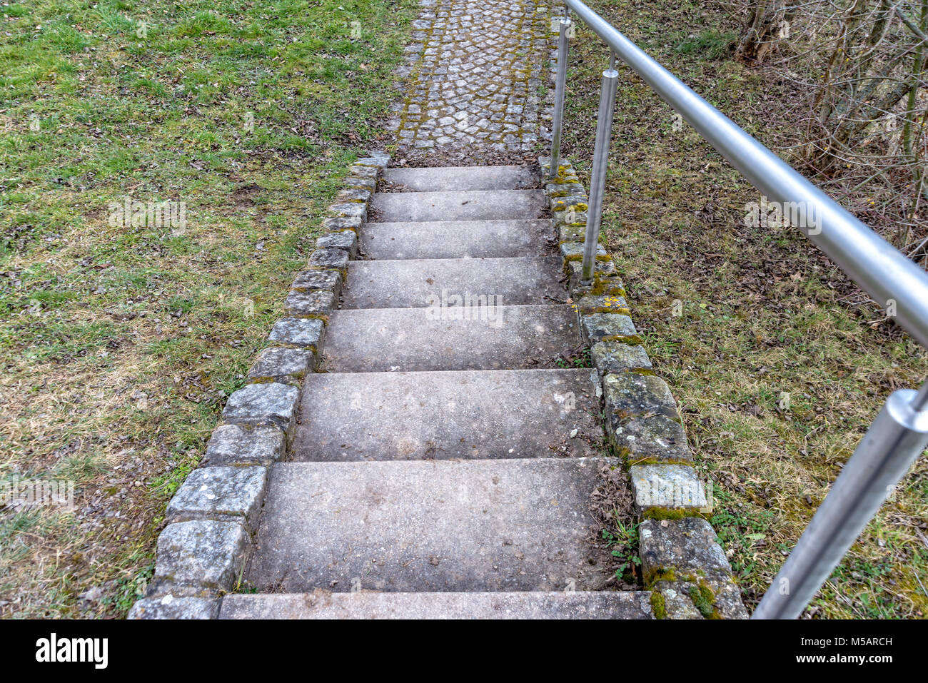 Stone stairs with a metal railing Stock Photo - Alamy