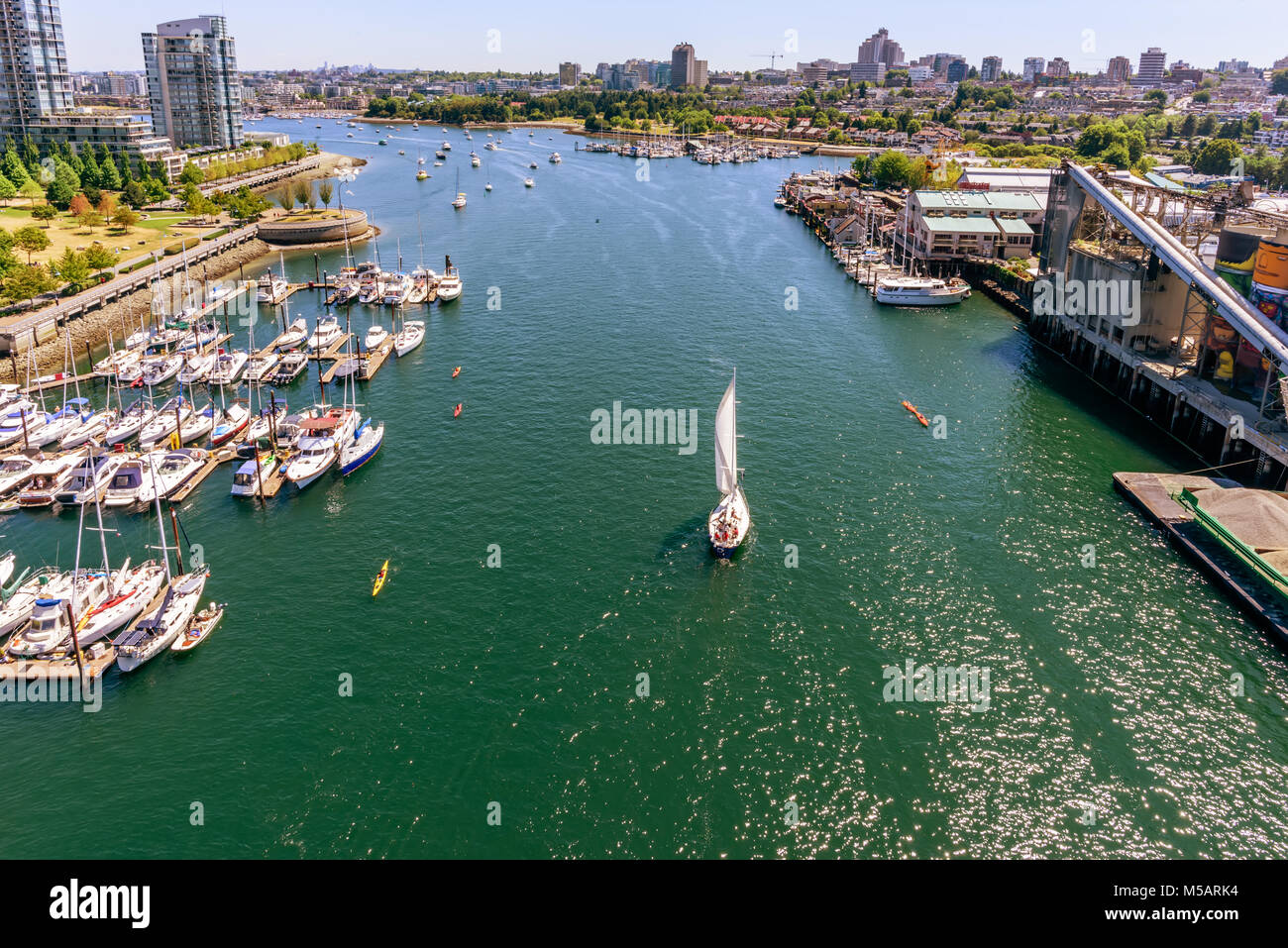 a view from above on a modern city with a waterfront, high-rise ...