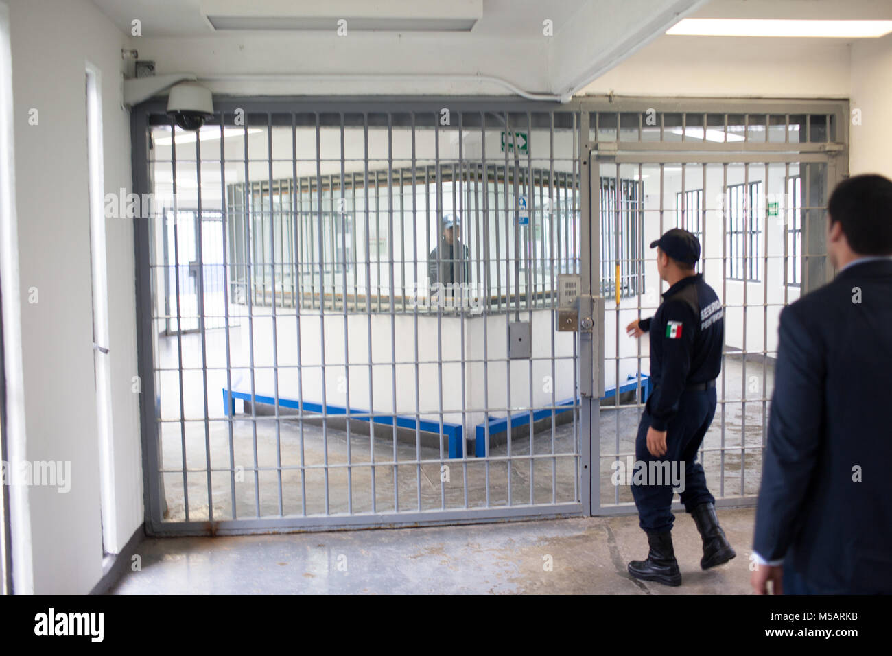 A prison guard leads people through Altiplano prison, from which Joaquin "El Chapo" Guzman ...