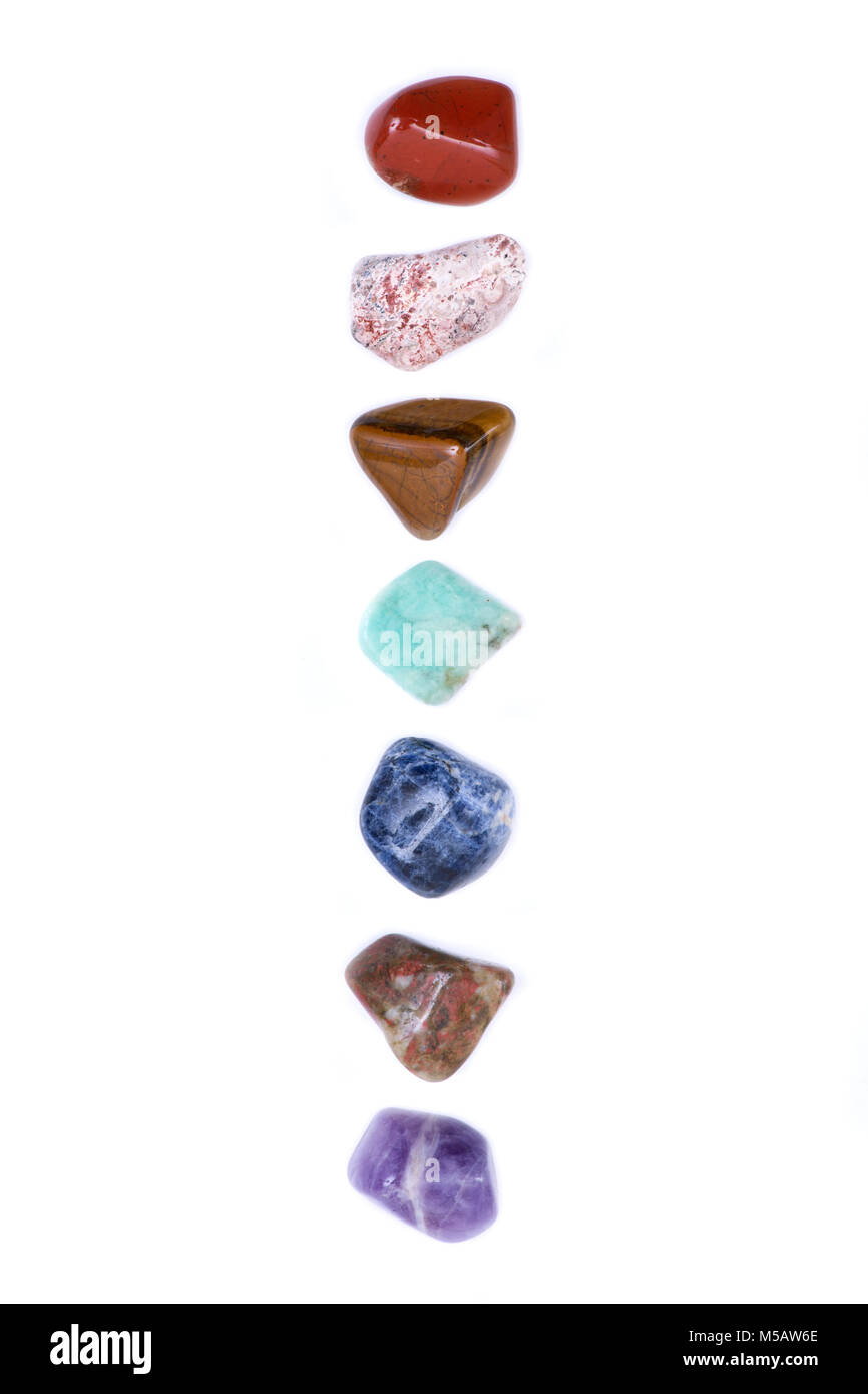 Set of seven healing chakra stones for crystal healing, isolated on ...