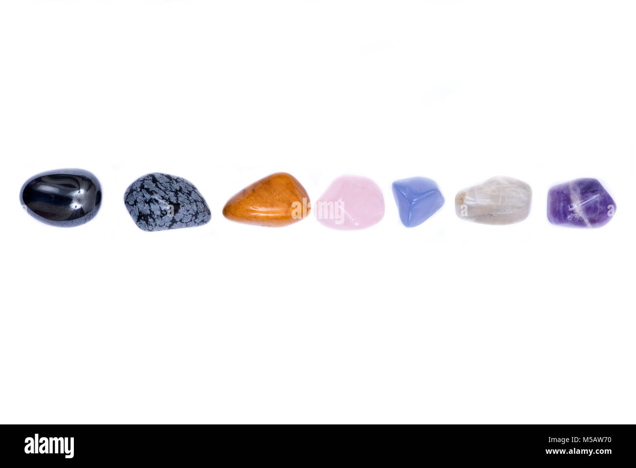 Set of seven healing chakra stones for crystal healing, isolated on ...