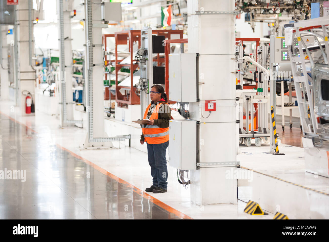 A worker in the golf vehicle section of the Volkswagen factory in ...