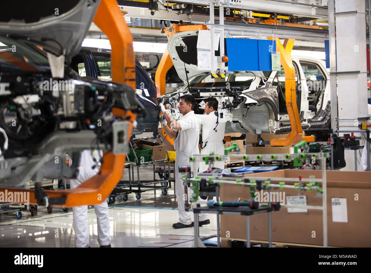 Workers in the golf vehicle section of the Volkswagen factory in Puebla ...