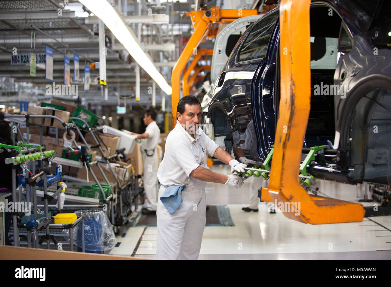 A worker in the golf vehicle section of the Volkswagen factory in ...
