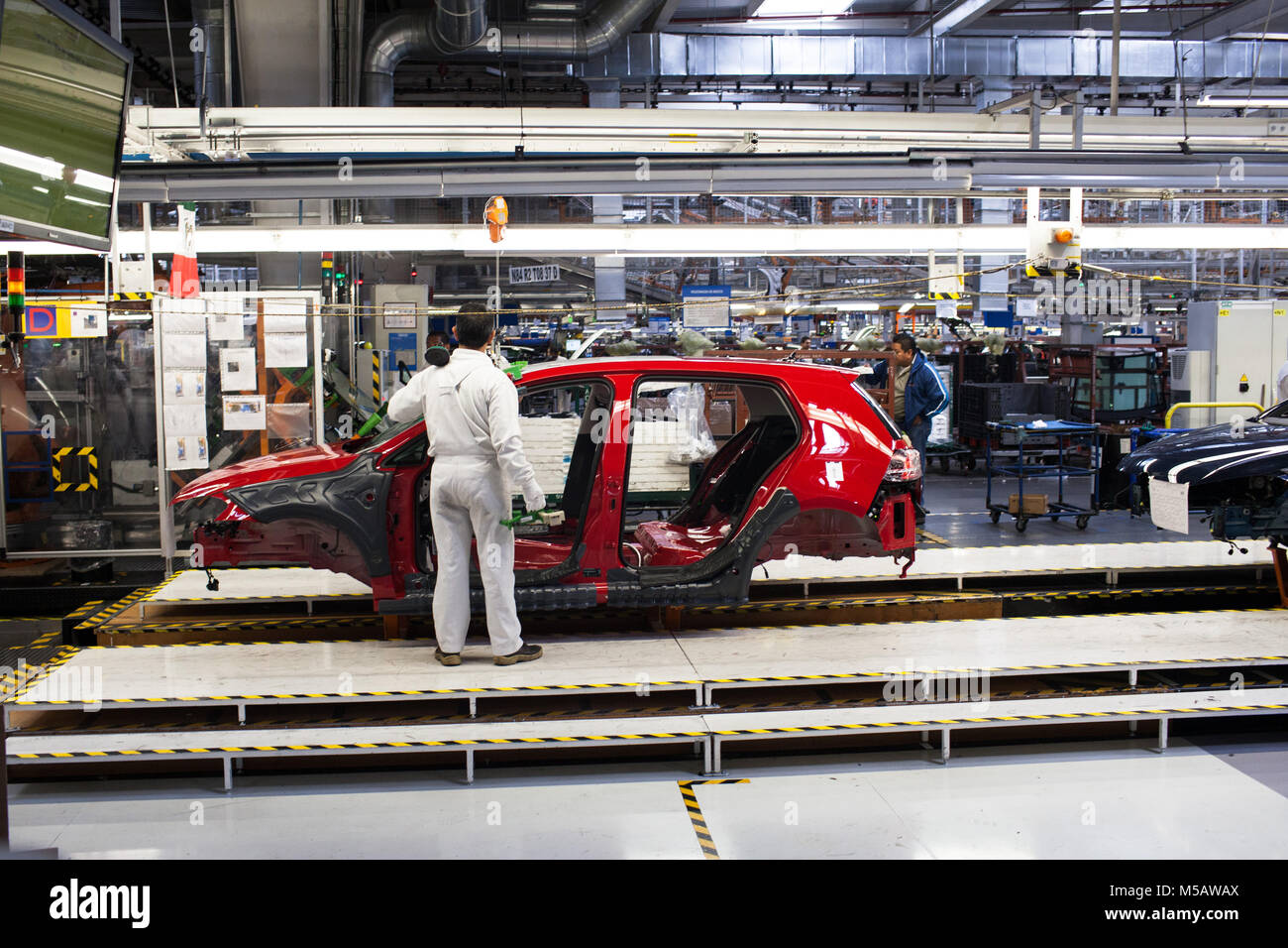 A worker in the golf vehicle section of the Volkswagen factory in ...