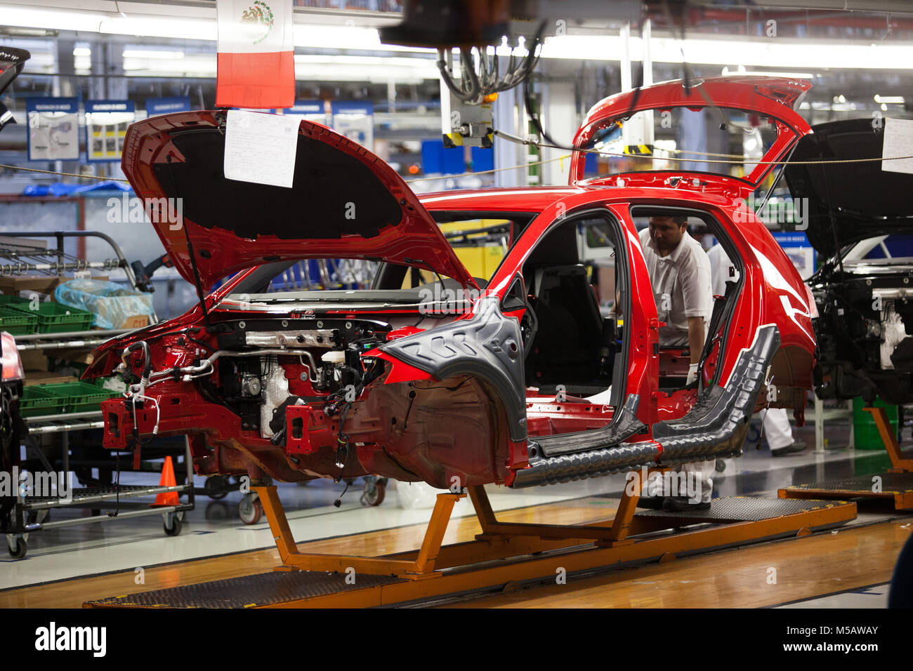 A worker in the golf vehicle section of the Volkswagen factory in ...