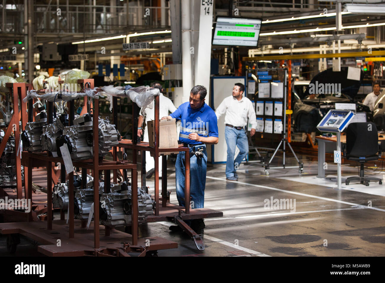 Workers in the golf vehicle section of the Volkswagen factory in Puebla ...