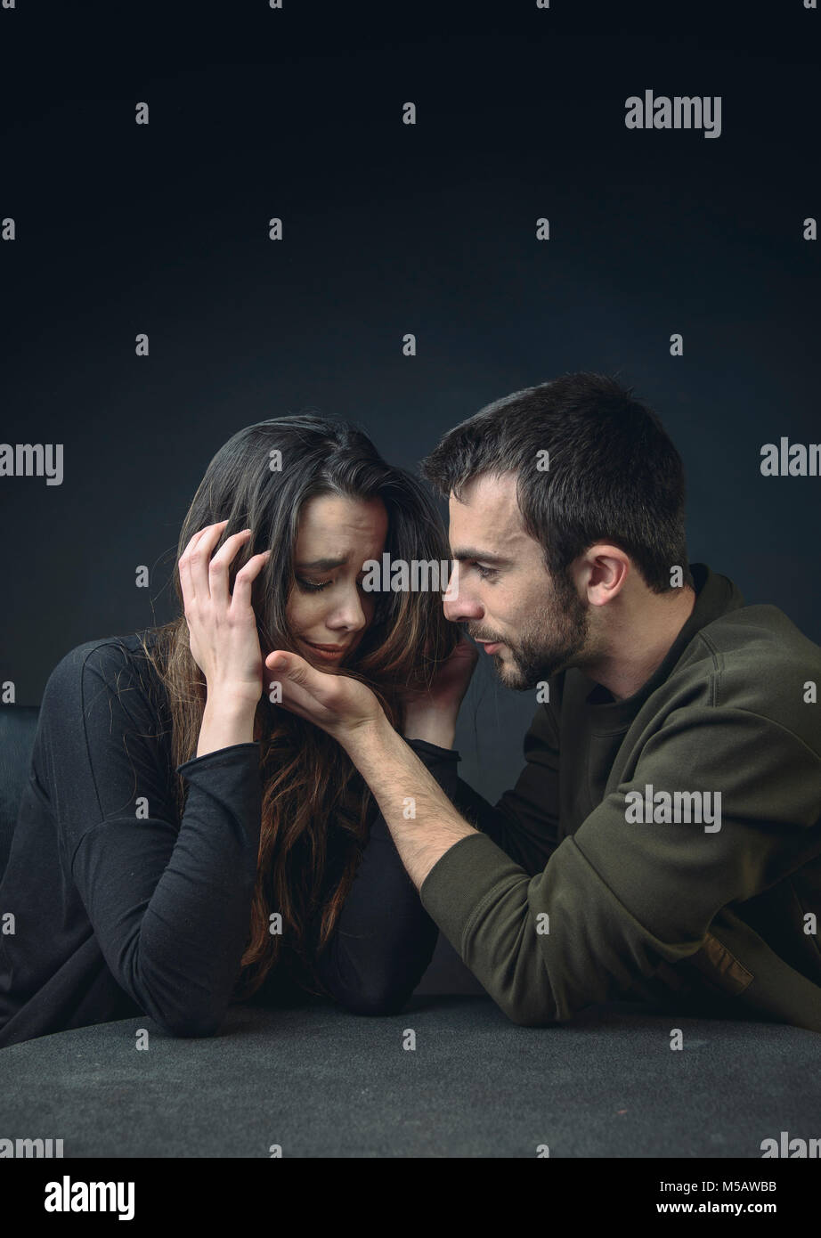 Young man comforting crying girlfriend hi-res stock photography and ...