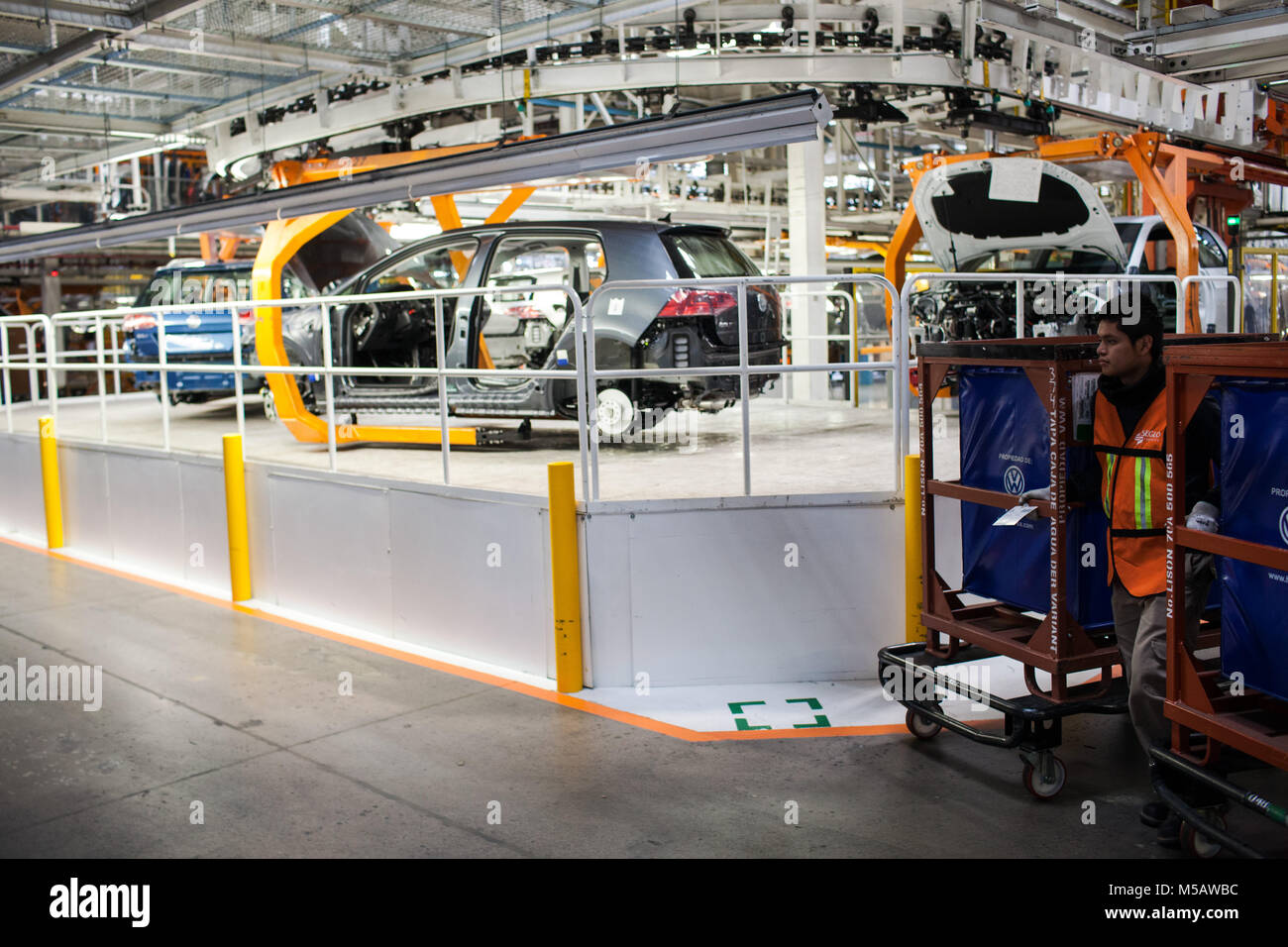 A worker in the golf vehicle section of the Volkswagen factory in ...
