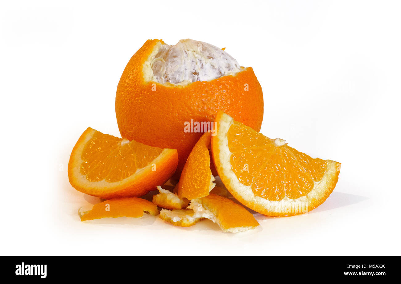 Partially peeled orange with slices Stock Photo - Alamy