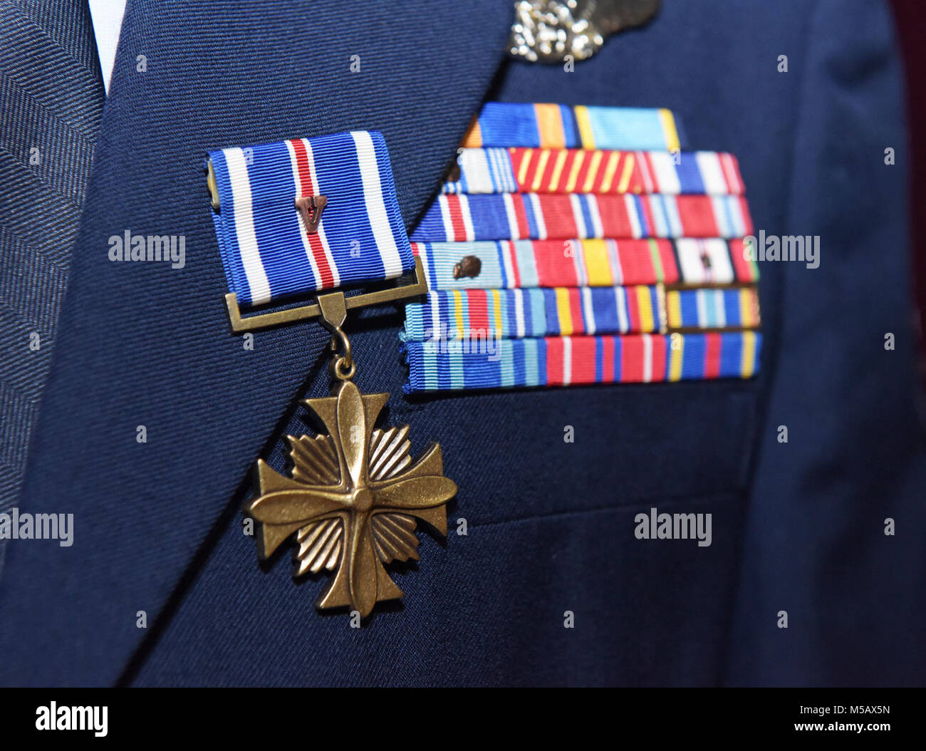 The Distinguished Flying Cross with Valor device is pinned on the ...