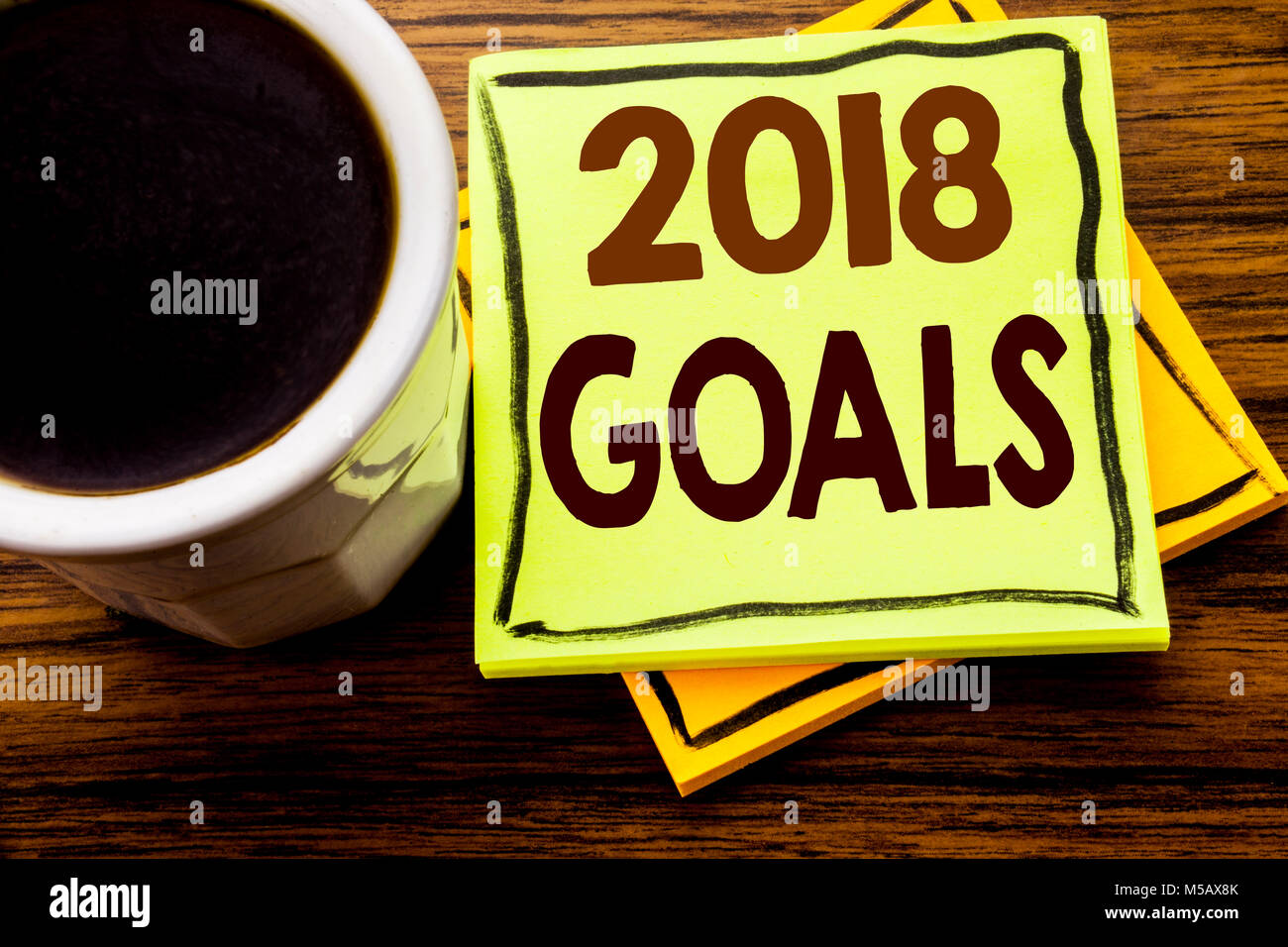 Handwritten text showing 2018 Goals. Business concept for New Yer ...
