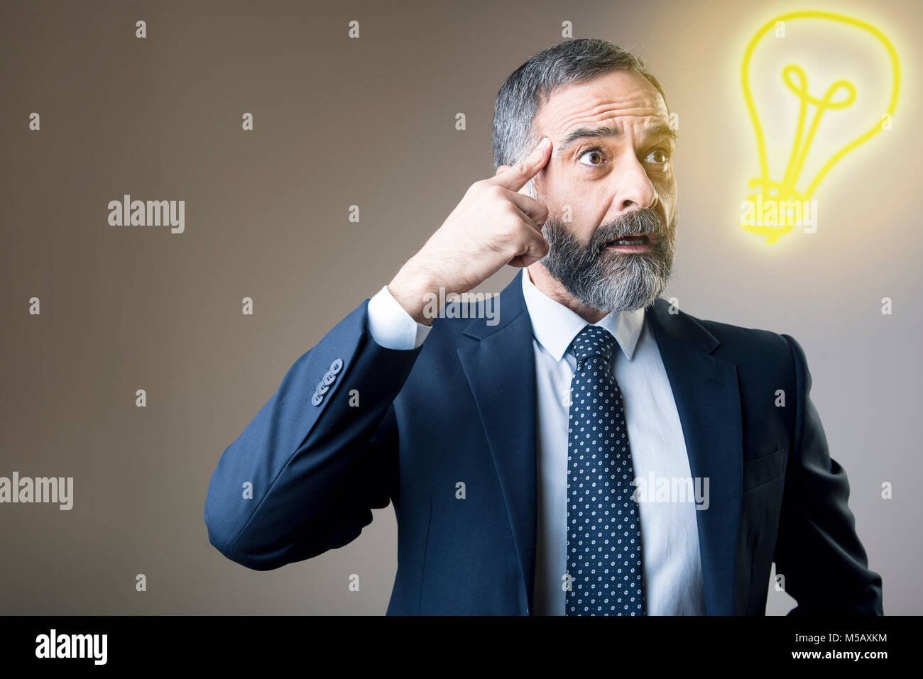 Elderly businessman got an idea Stock Photo - Alamy