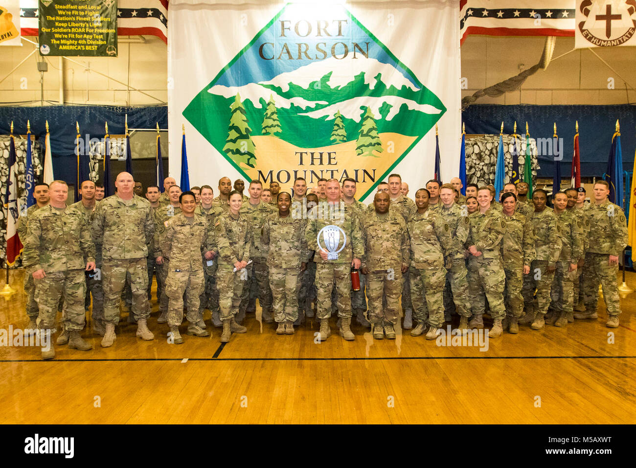 (Center) Command Sgt. Maj. Weston West, outgoing 71st Ordnance Group ...