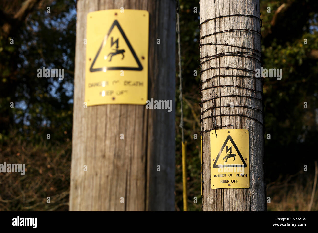 Electricity pole barbed wire warning hi-res stock photography and ...