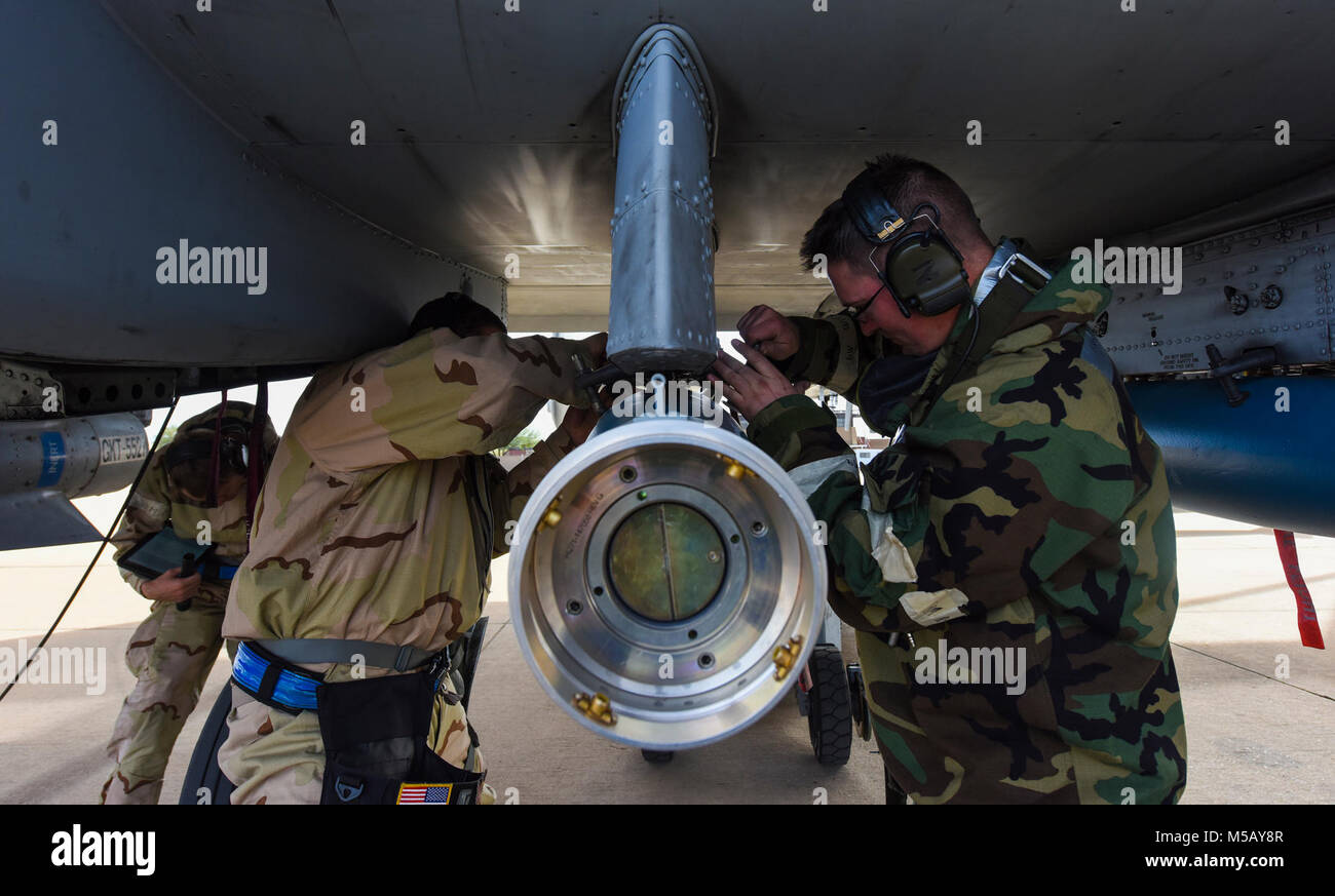 U.S. Airmen load a bomb onto an A-10C Thunderbolt II during the ...