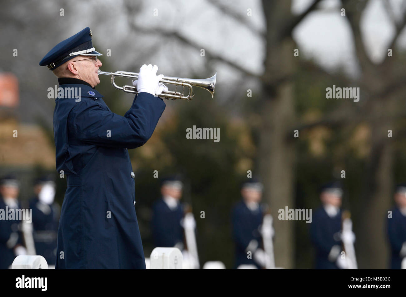A U.S. Air Force Ceremonial Guardsmen performs TAPS during the full ...