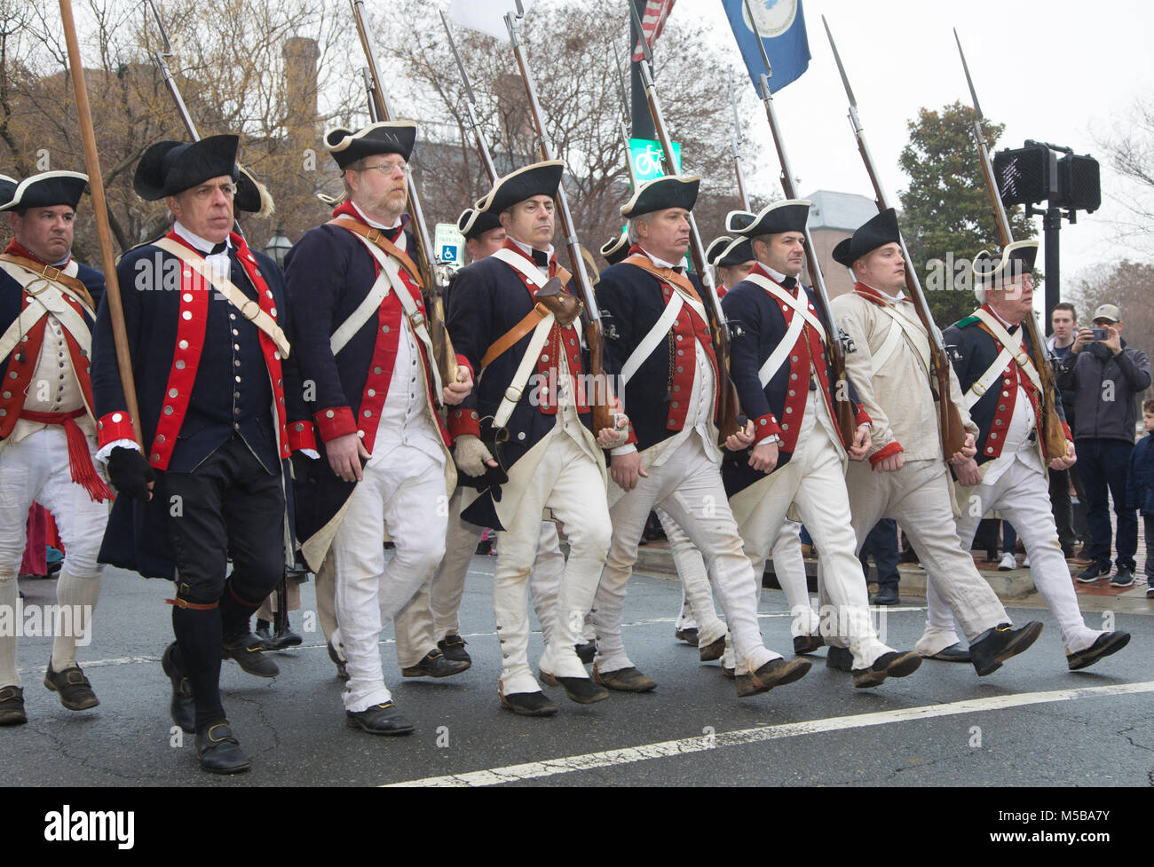 Reenactors of the First Virginia Regiment march with muskets in the ...