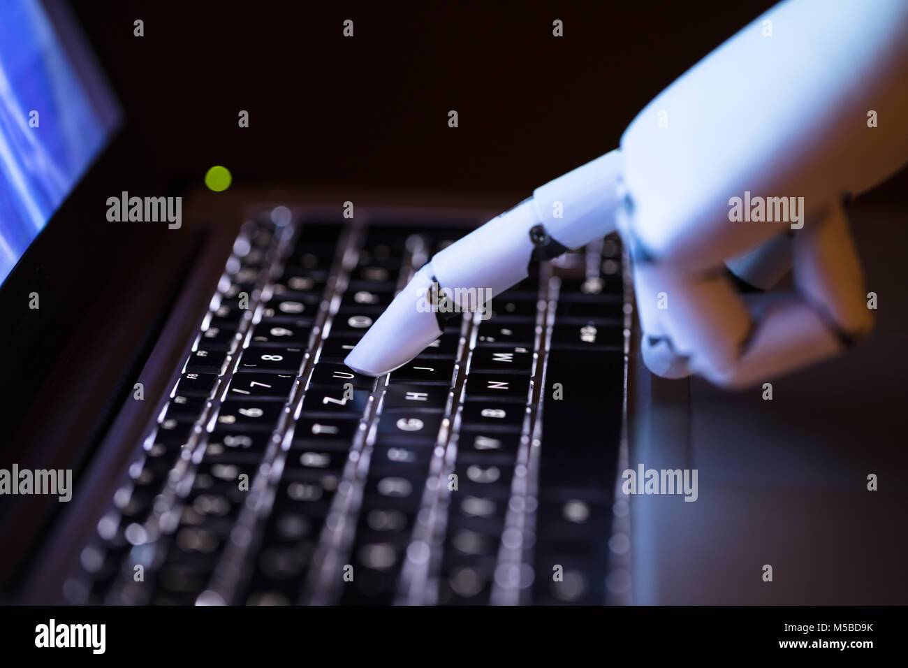 Robot typing on computer keyboard hi-res stock photography and images ...