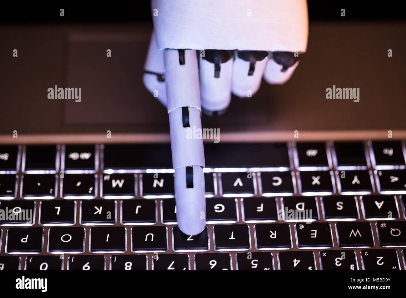 Robot typing on computer keyboard hi-res stock photography and images ...