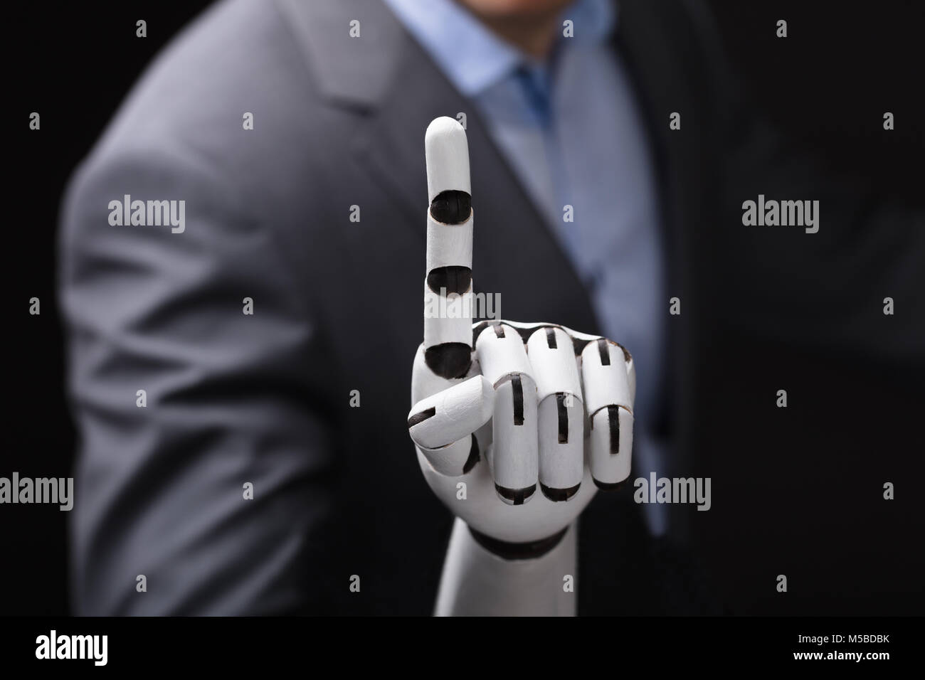 Close-up Of A Businessperson With Robotic Arm Touching Screen Stock ...