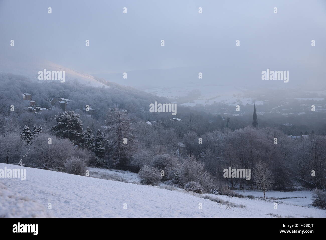 Village covered by snow and mist in rural area of UK Stock Photo - Alamy