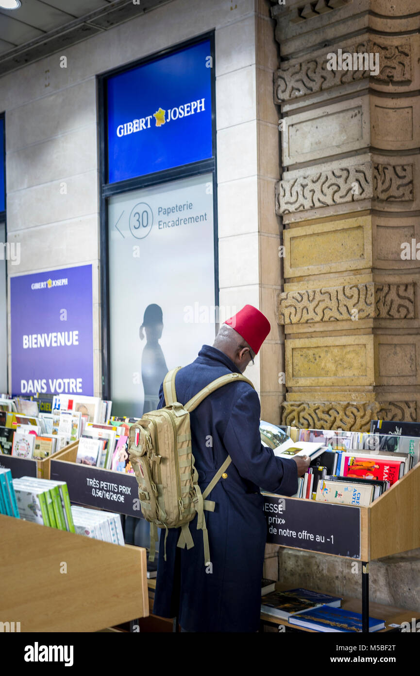 Person looking at books hi-res stock photography and images - Alamy