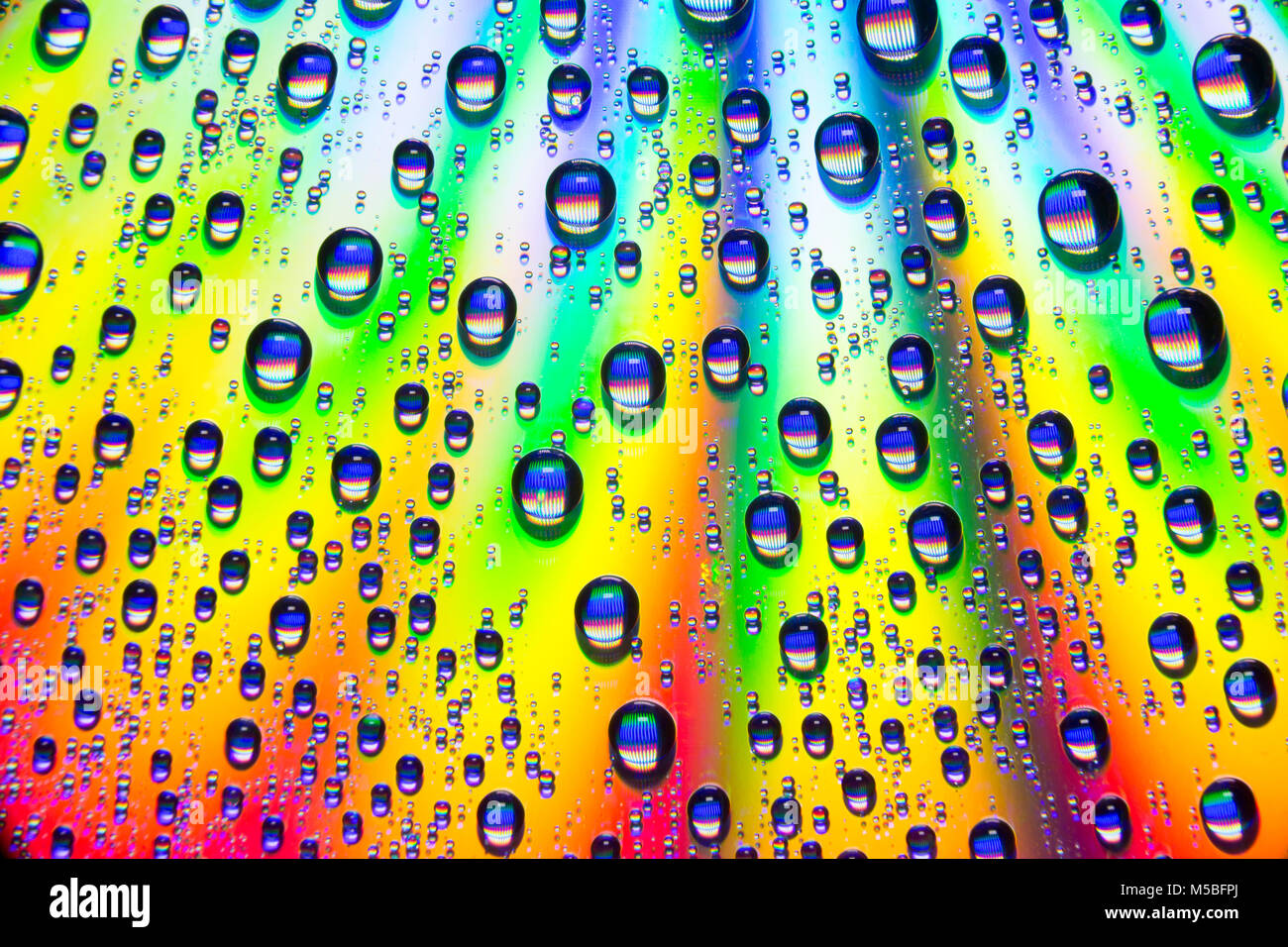Water droplets on the shiny surface of a DVD. England UK GB Stock Photo ...