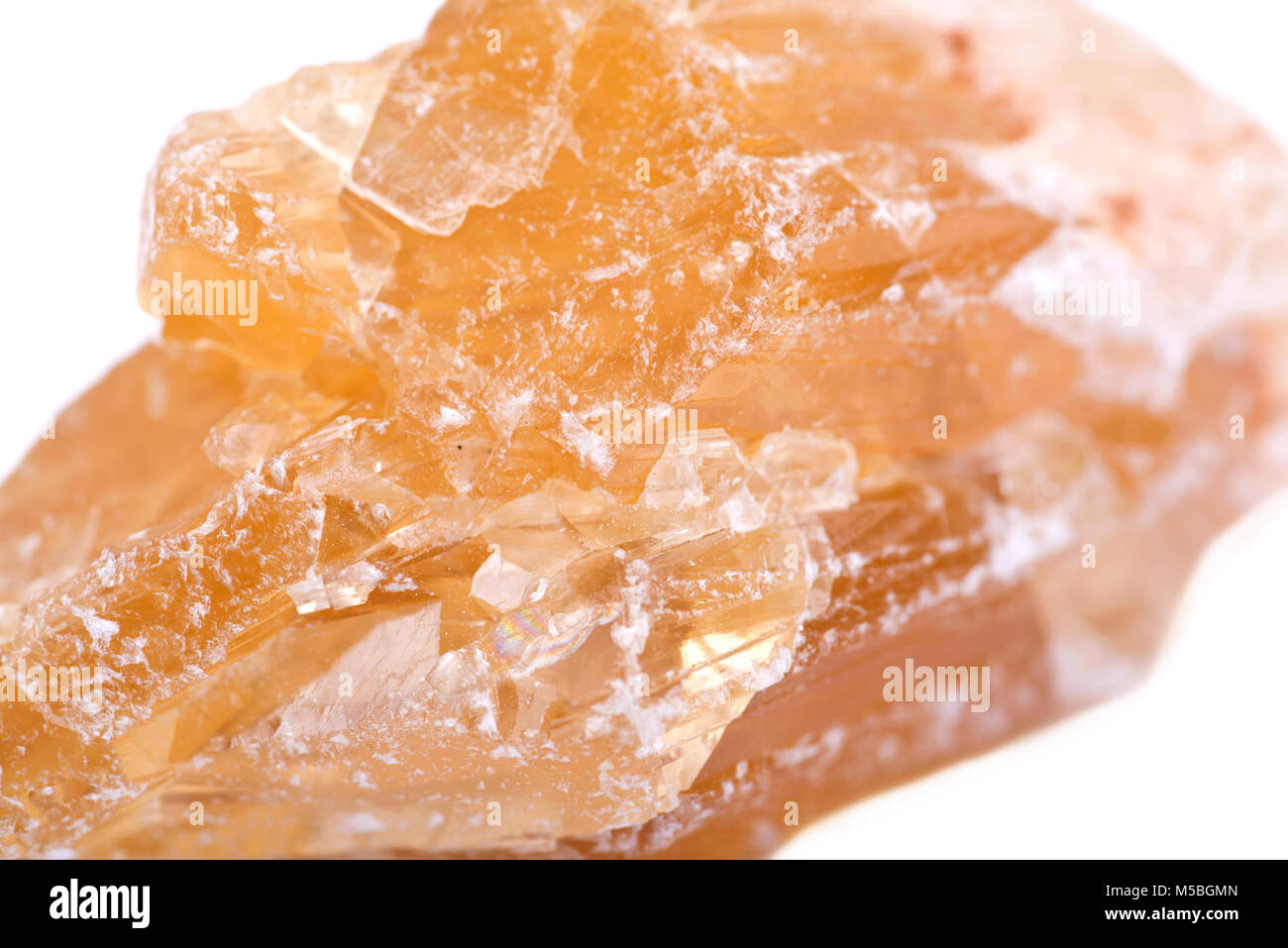 Partially crystallized golden Scapolite from Nigeria isolated on white ...