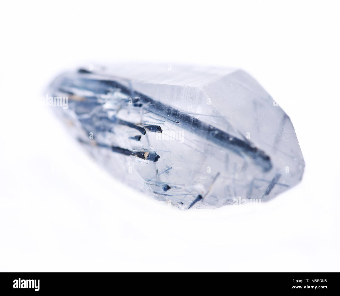 Blue quartz point with tourmaline inclusions from Brazil isolated on ...