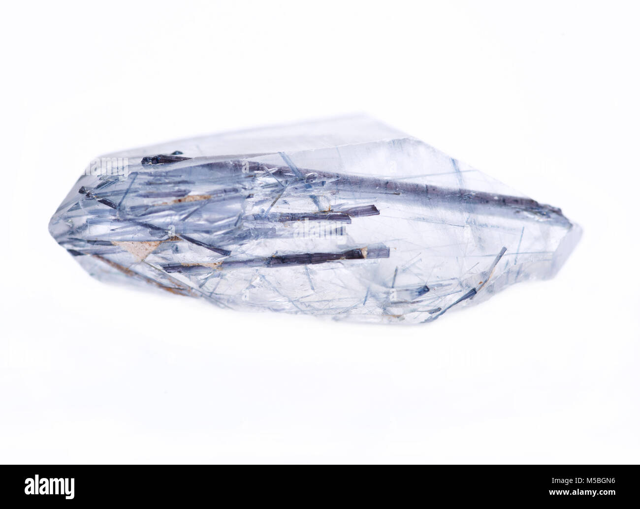 Blue quartz point with tourmaline inclusions from Brazil isolated on ...
