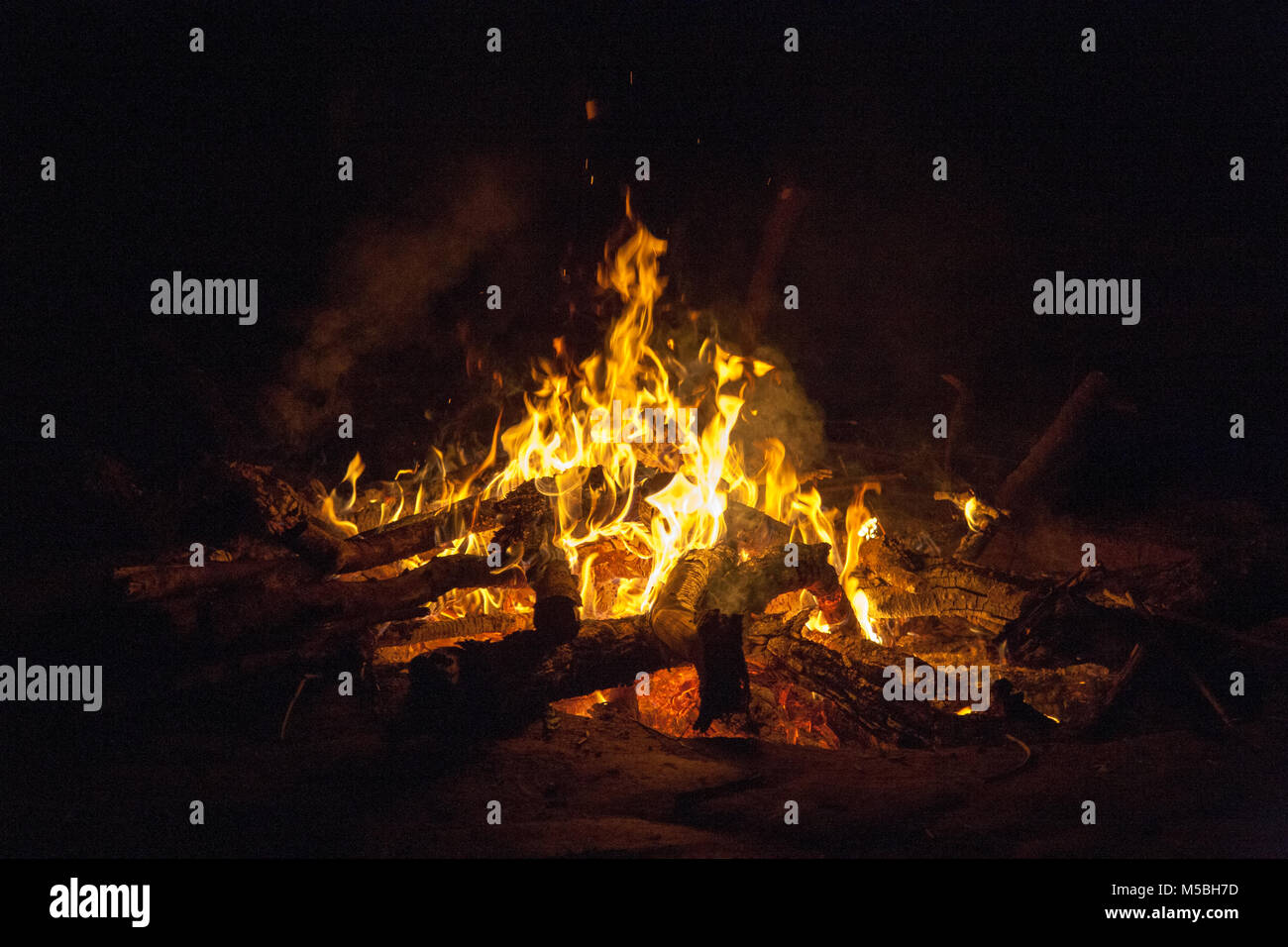 Campfire on black background Stock Photo - Alamy