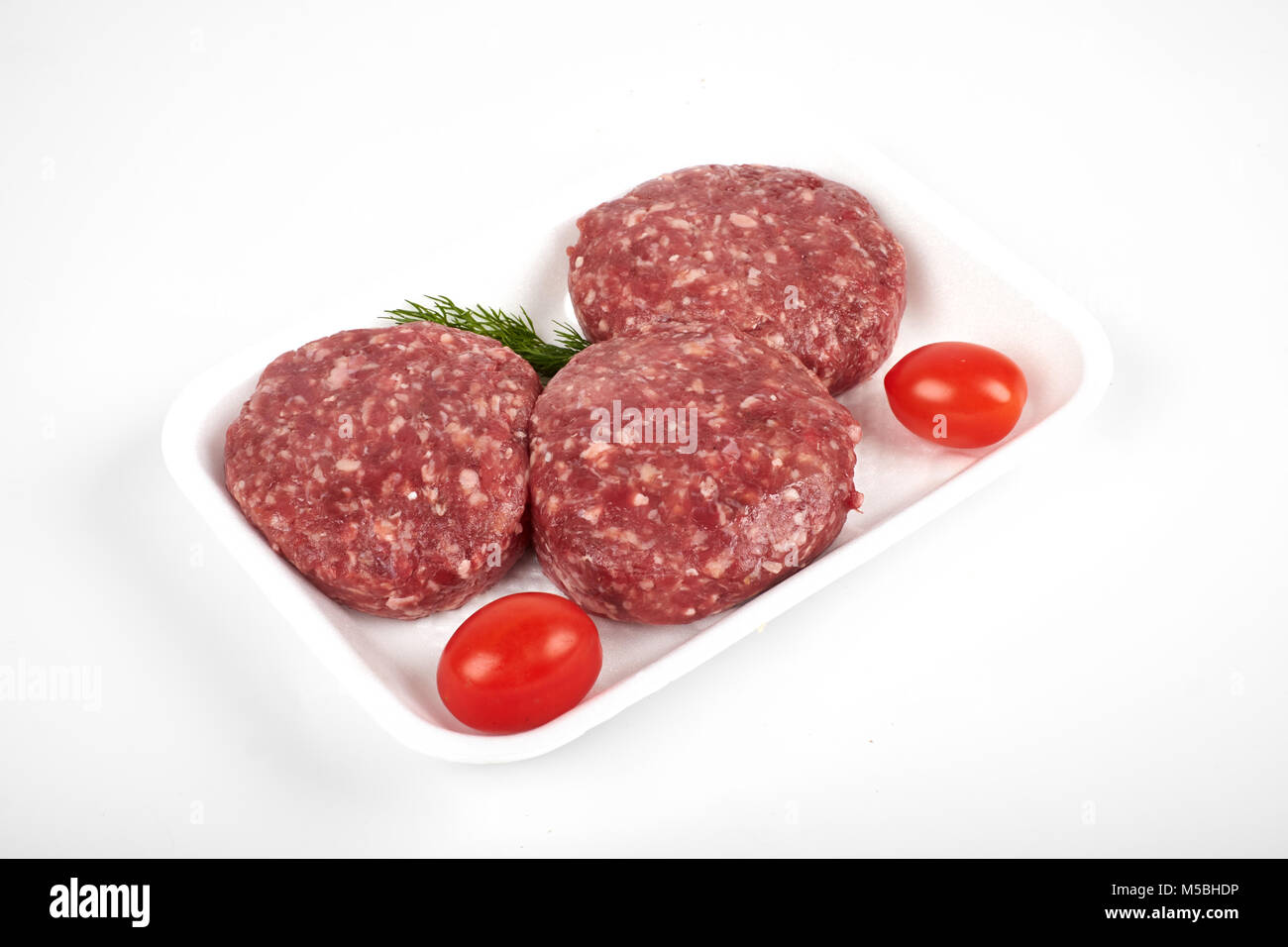 minced meat in plastic package isolated on white background Stock Photo ...