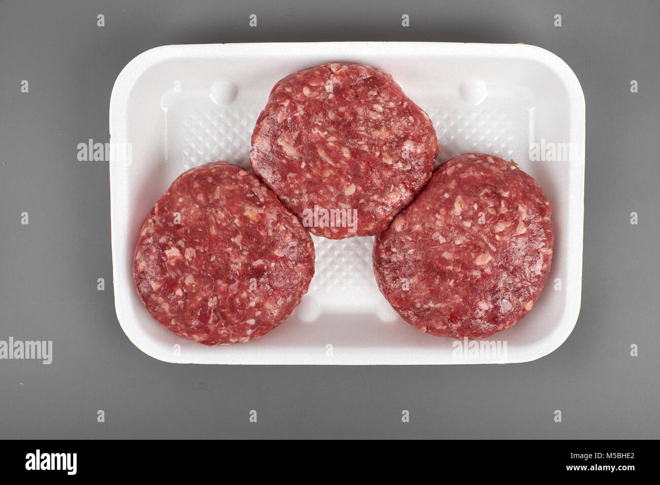 beef burgers in plastic package isolated on white background Stock ...