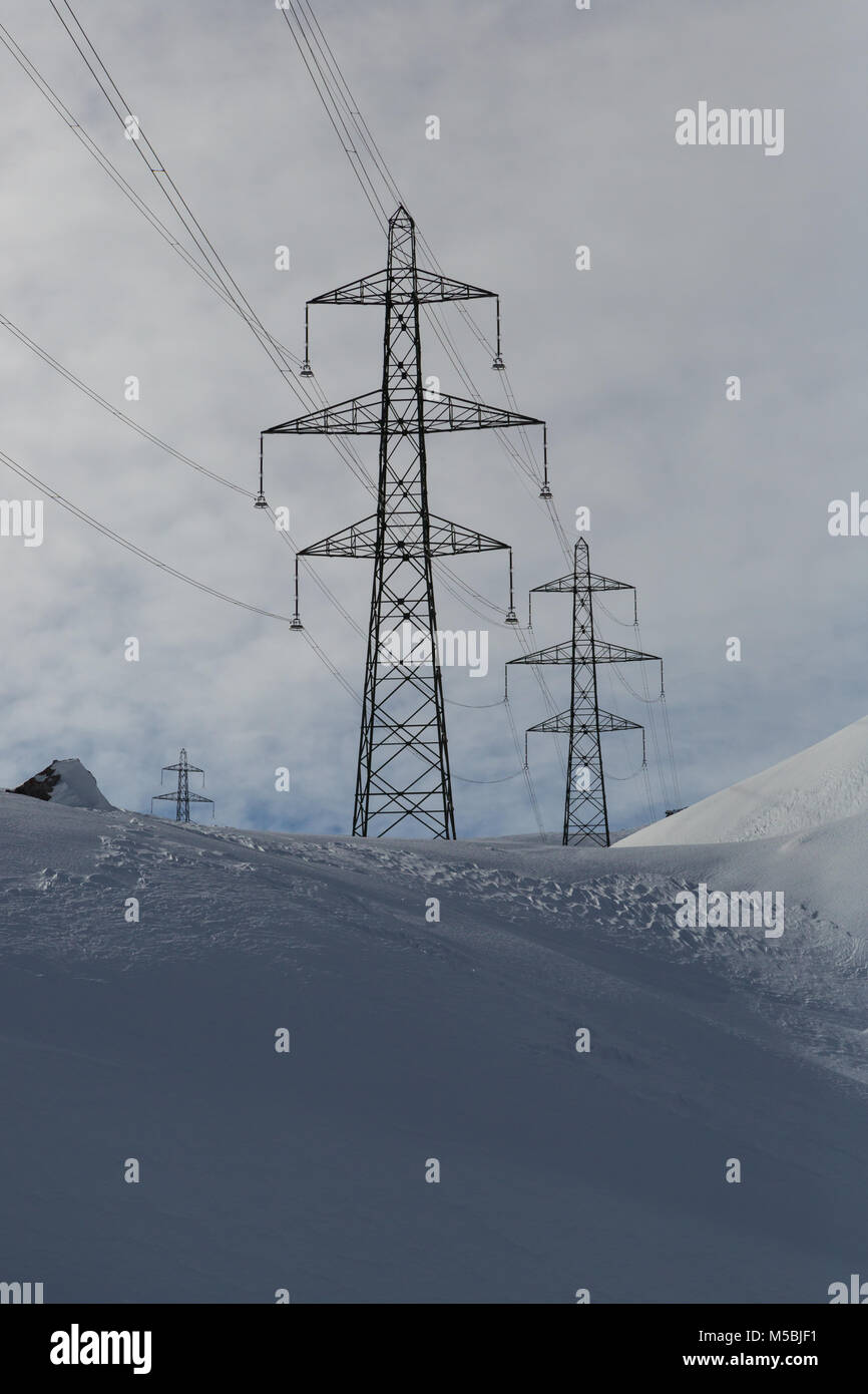 electricity pylons in winter mountains, white snow Stock Photo - Alamy