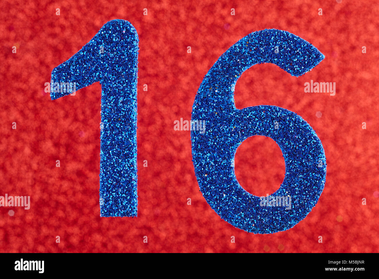 Number sixteen blue color over a red background. Anniversary ...